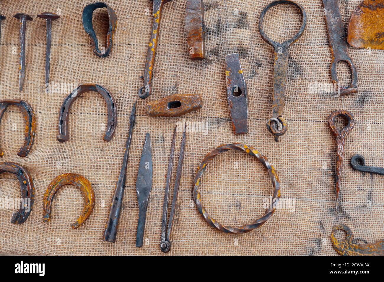 tools and metal objects for blacksmith's work as a background Stock ...