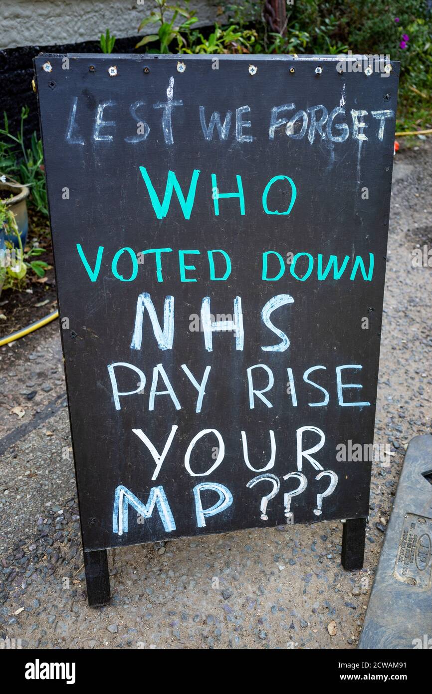 Political message written on a blackboard outside a house Stock Photo ...