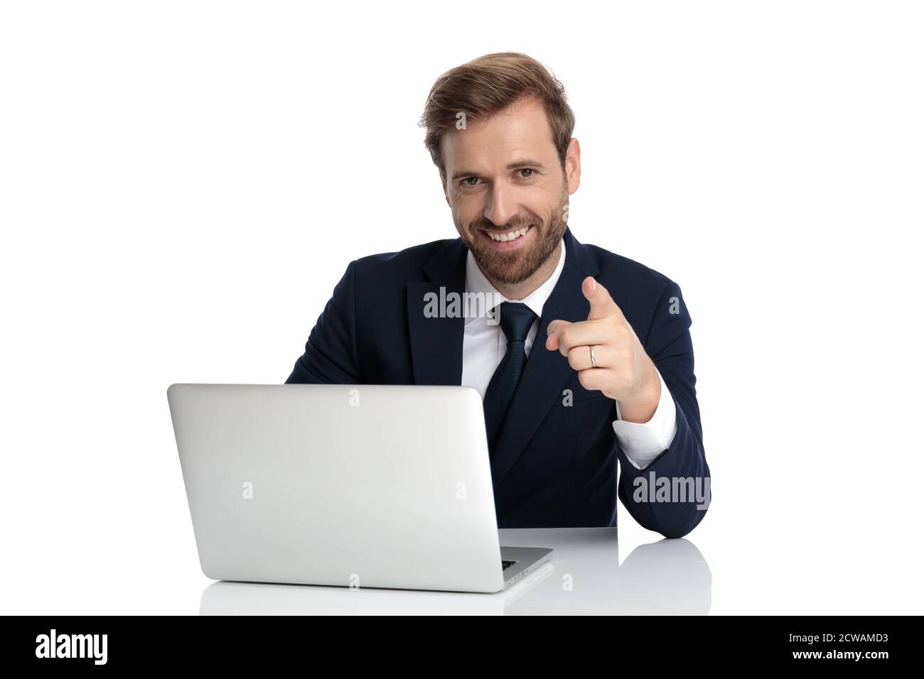 happy businessman in navy blue suit smiling and pointing finger ...