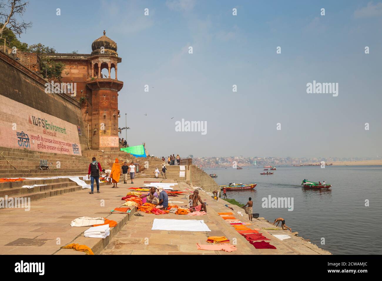 India, Uttar Pradesh, Varanasi, Washing drying on banks of Ganges river ...