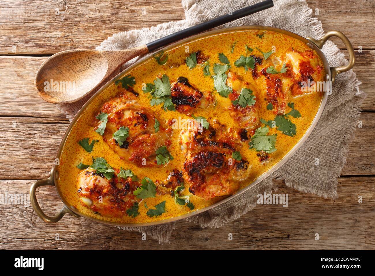 Kenyan Kuku Paka is a chicken roasted over charcoal and then cooked in ...