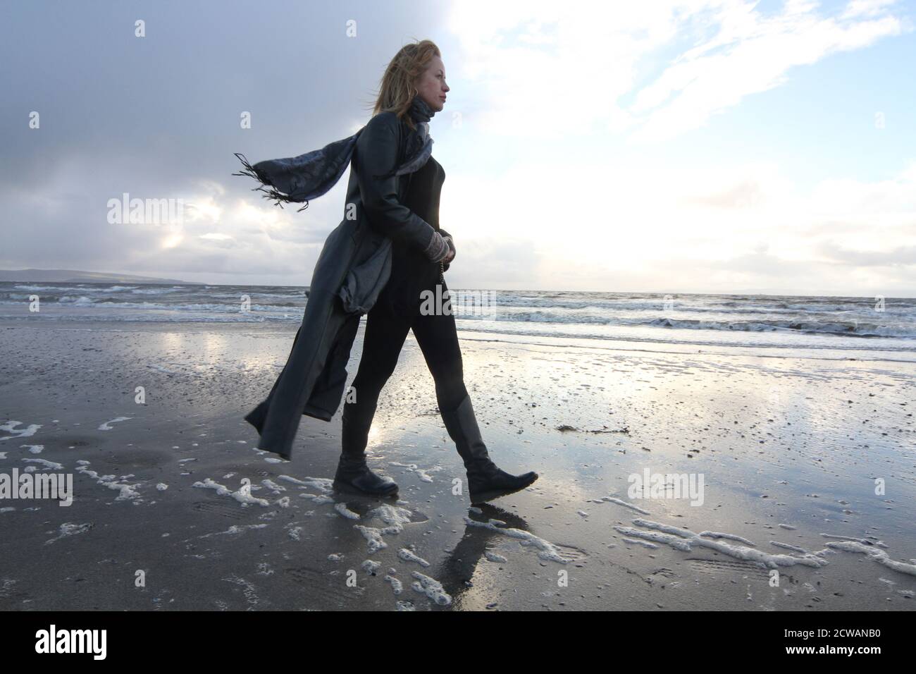 Middle aged white caucasian woman on the beach at Troon, Ayrshire with ...
