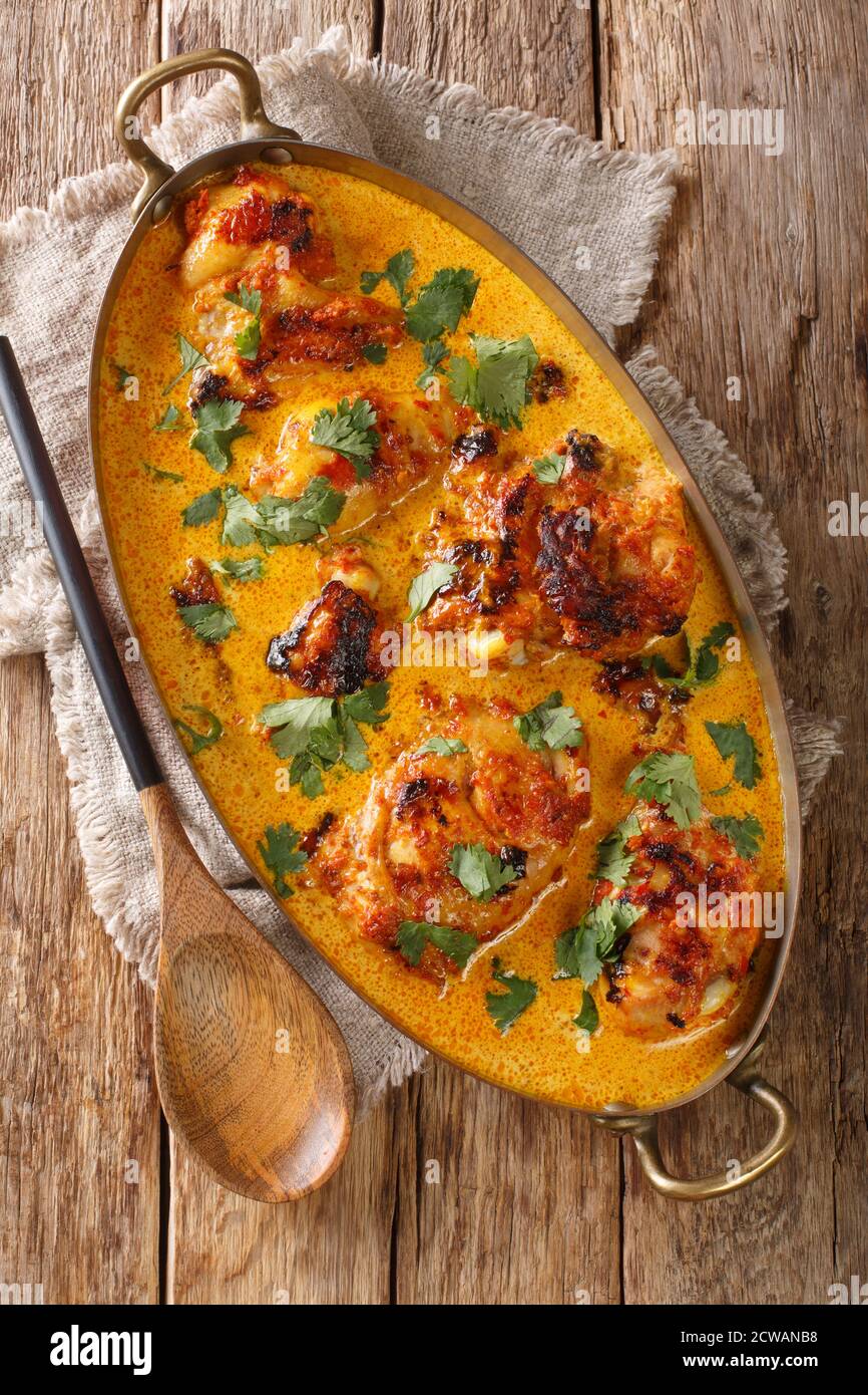 Kenyan chicken in coconut curry sauce Kuku Paka Recipe closeup on the ...