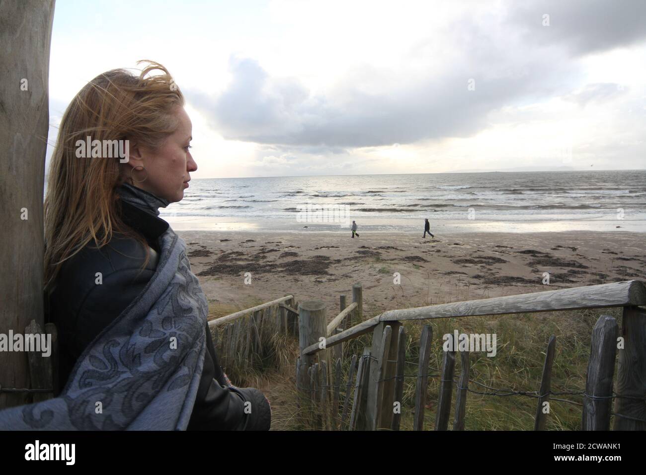 Middle aged white caucasian woman on the beach at Troon, Ayrshire with ...