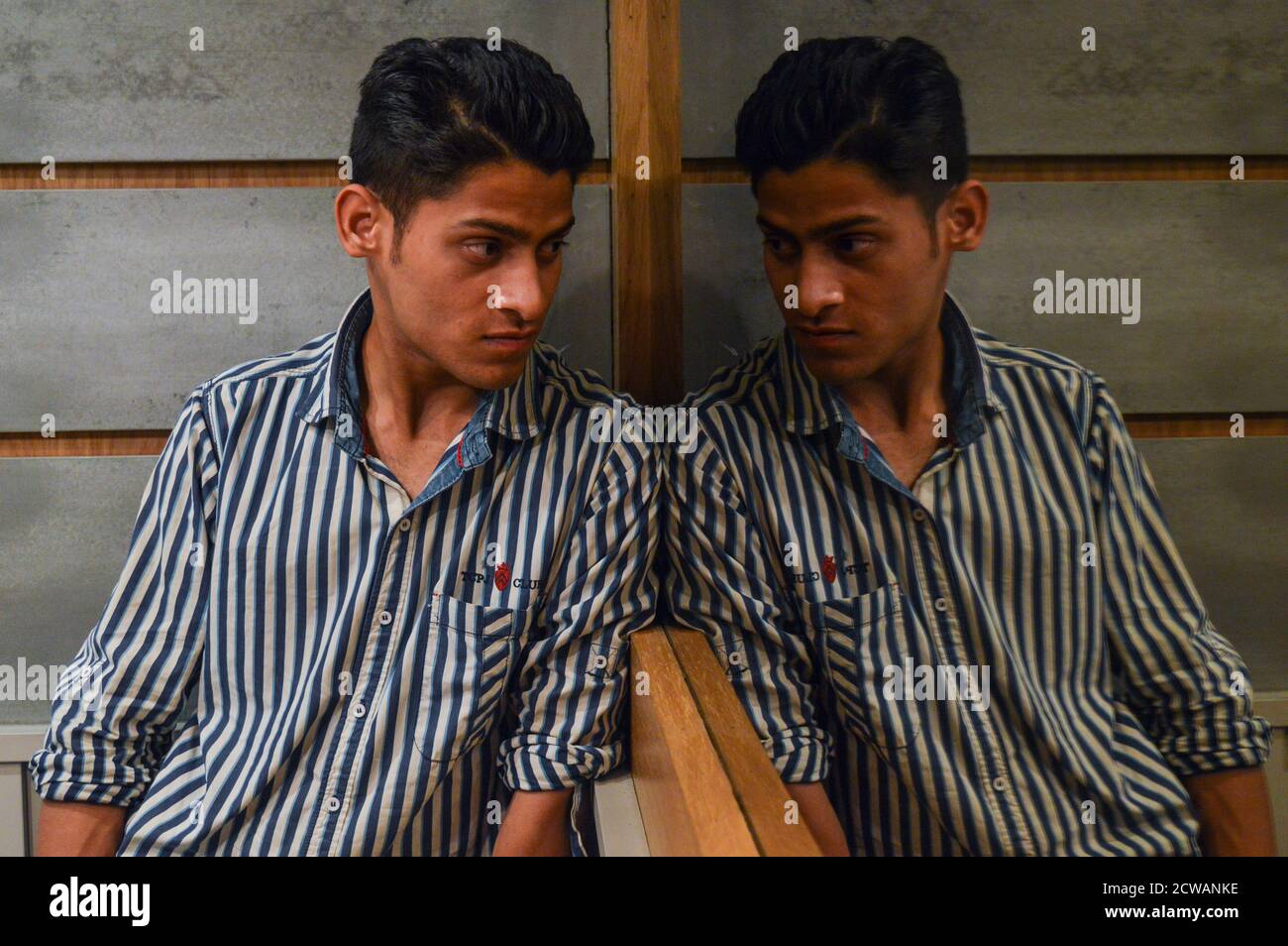 Indian boys giving poses for fashion photo shoot on studio with using ...