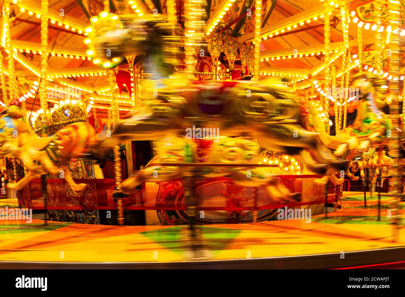 Colourful carousel with blurred movement Stock Photo - Alamy