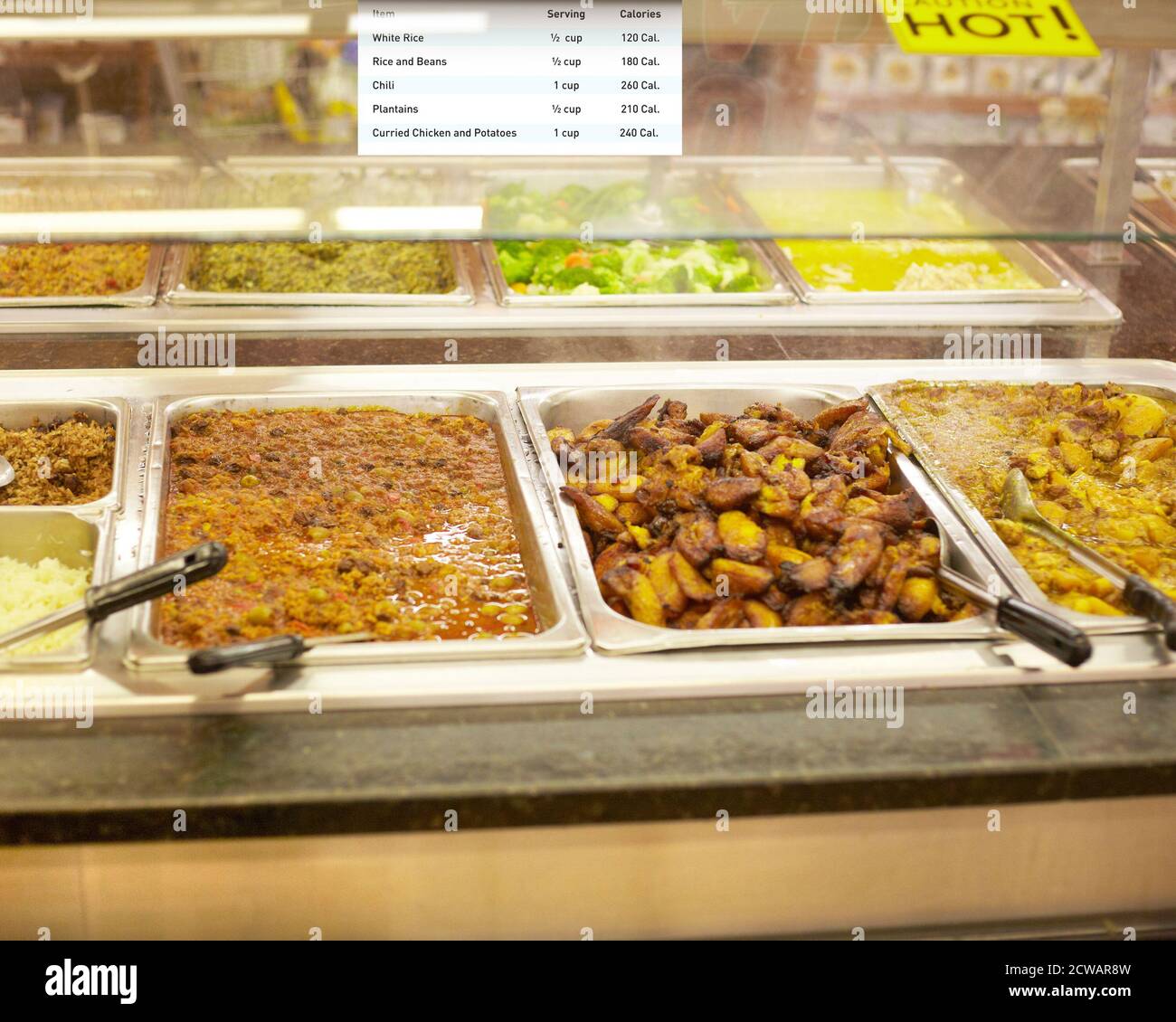 A single sign is displayed near self-serve foods, listing calories per ...