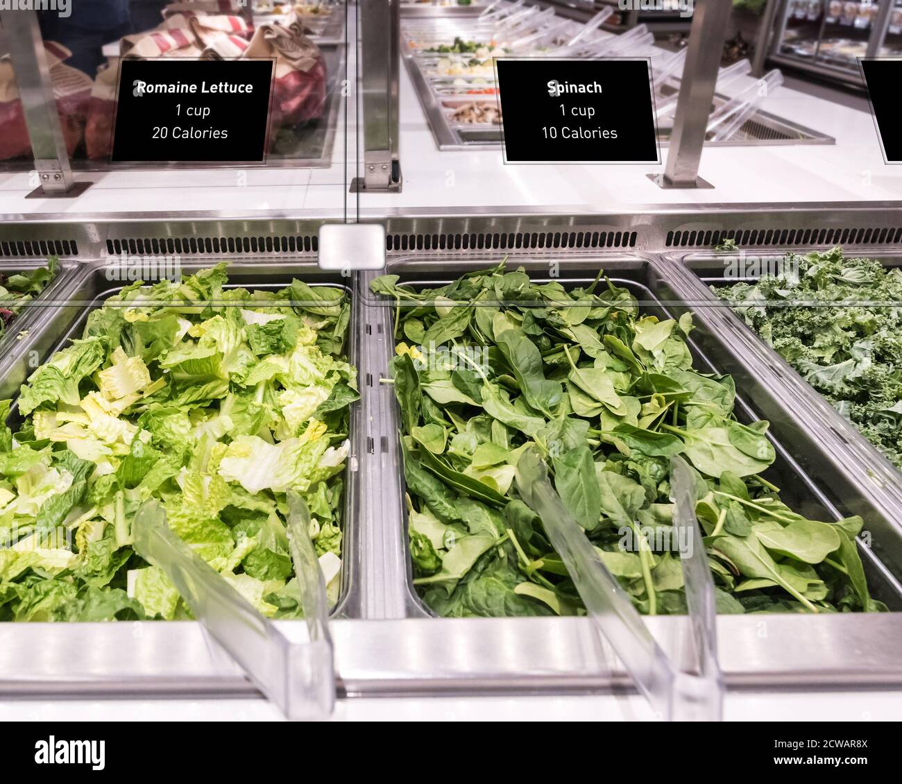 This image shows individual signs for self-service food items at a ...