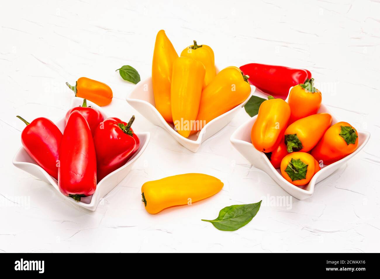 Assorted ripe multi-colored baby peppers: red, orange and yellow. Fresh ...