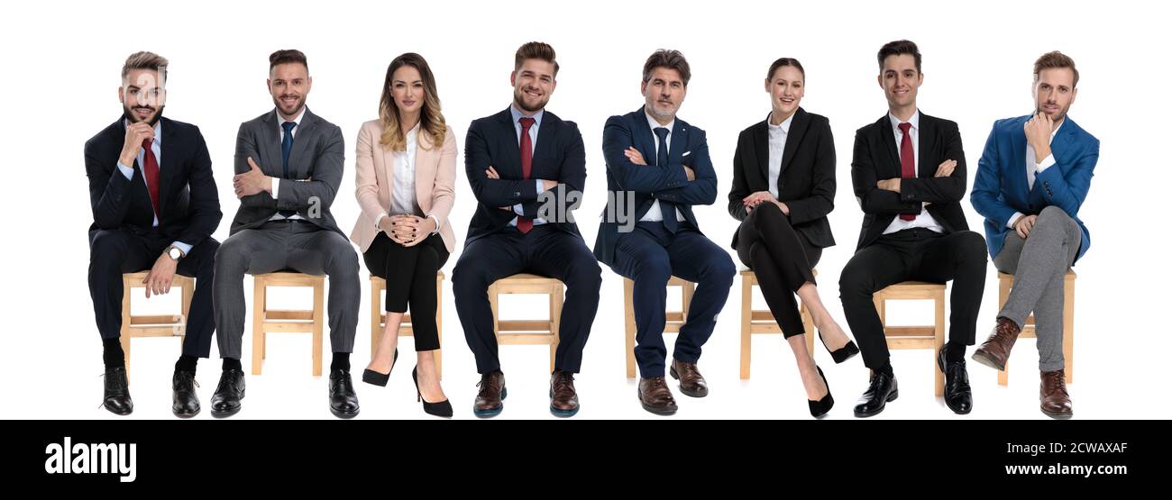 Team of 8 confident businessmen holding their arms crossed and smiling ...