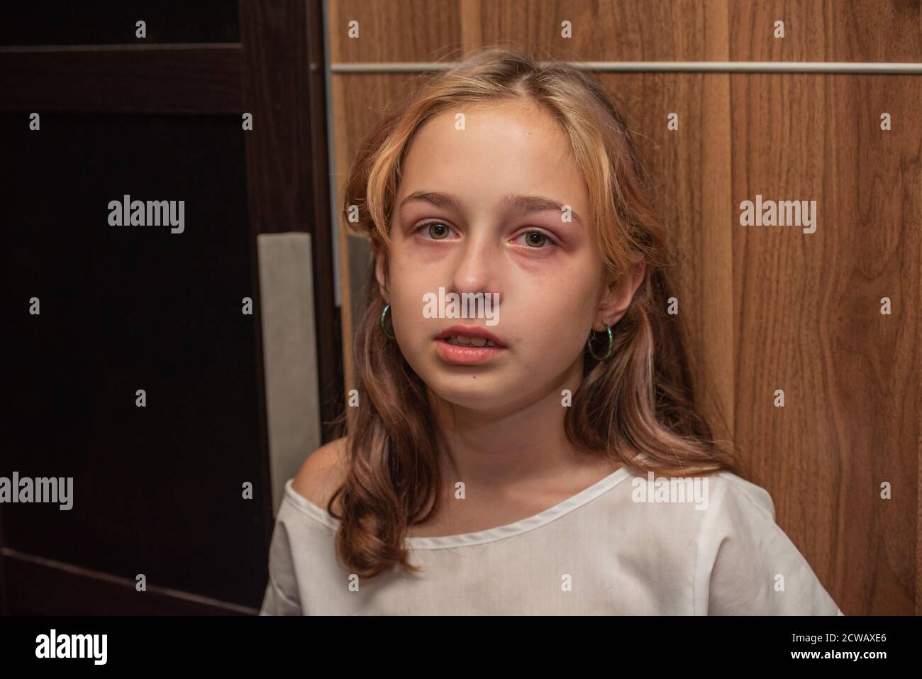 cute little kid is crying. Portrait of a sad child girl 9 or 10 years ...