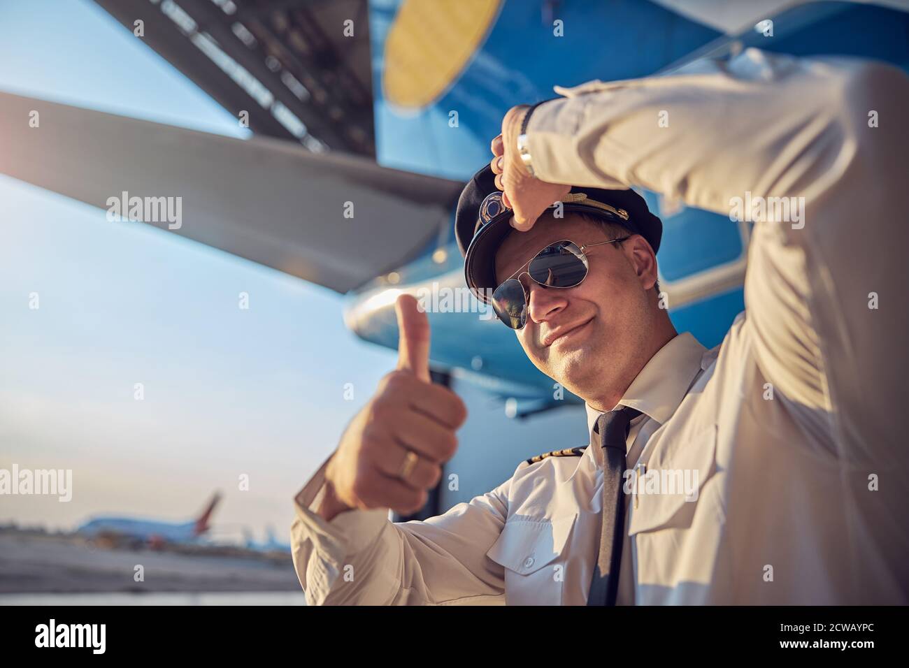 Confident air captain showing like while standing in the outdoors Stock ...