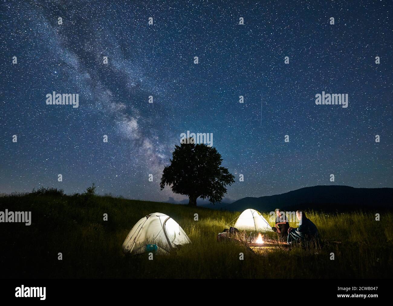 Sitting beside fire hi-res stock photography and images - Alamy