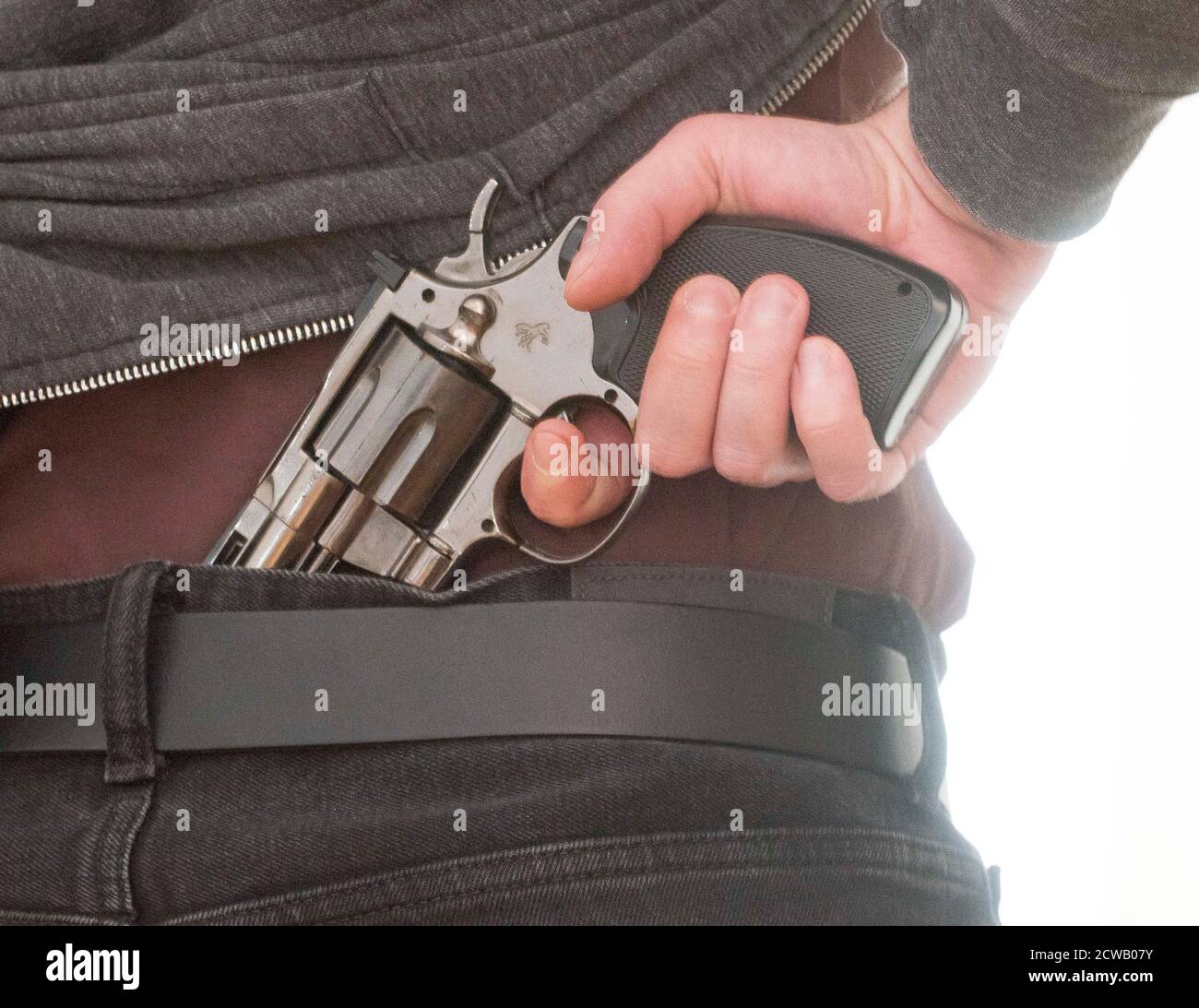 person with a revolver in hand, deadly and dangerous weapon Stock Photo ...