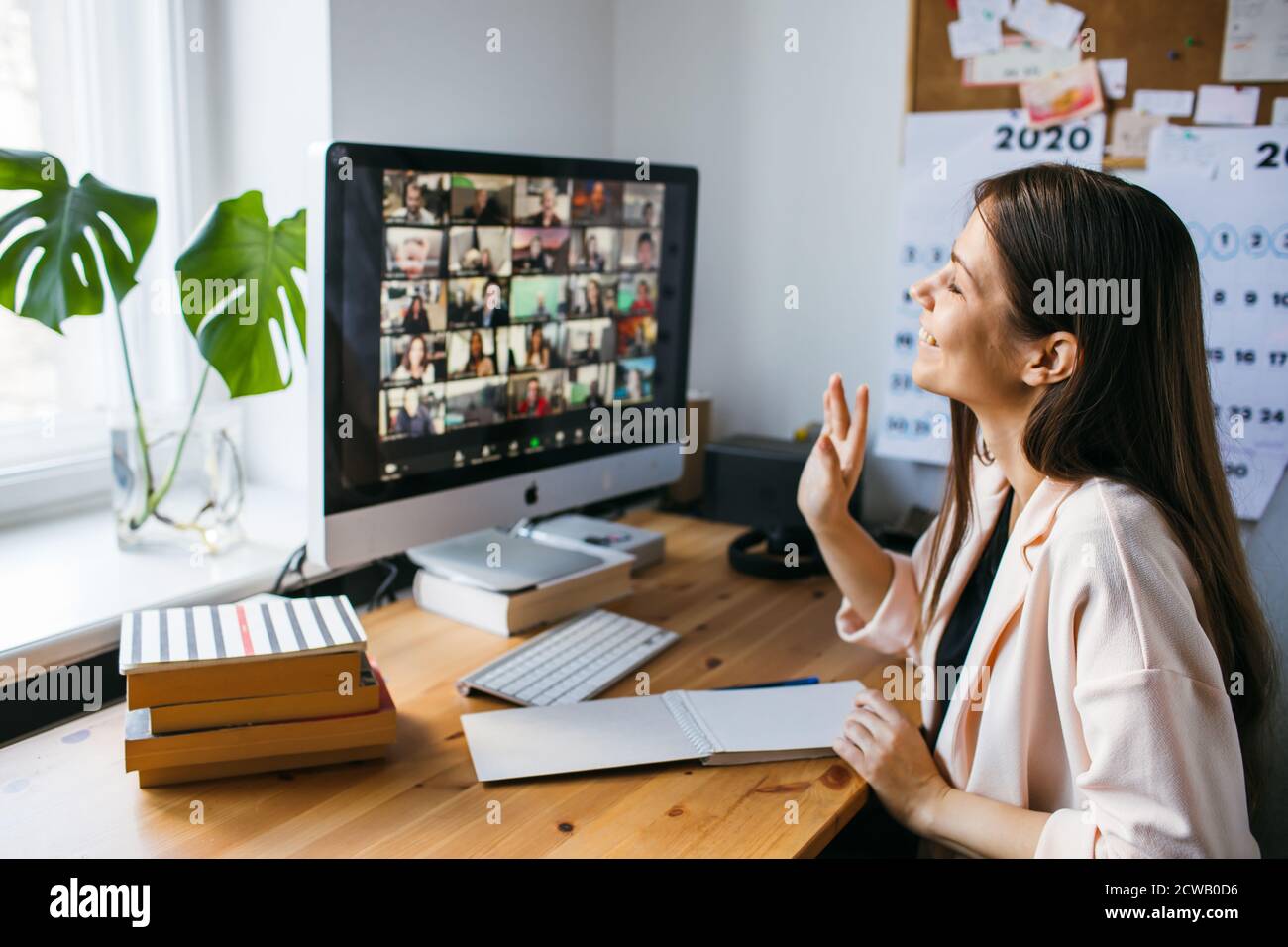 Business woman having Zoom video conference call via computer. Home ...
