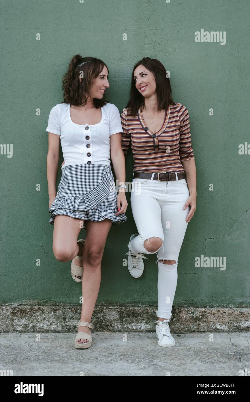 Gossip secret talking friendship hi-res stock photography and images ...