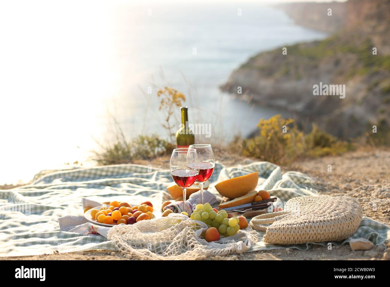 picknick outdoors with fruits and wine by sea in naure Stock Photo - Alamy