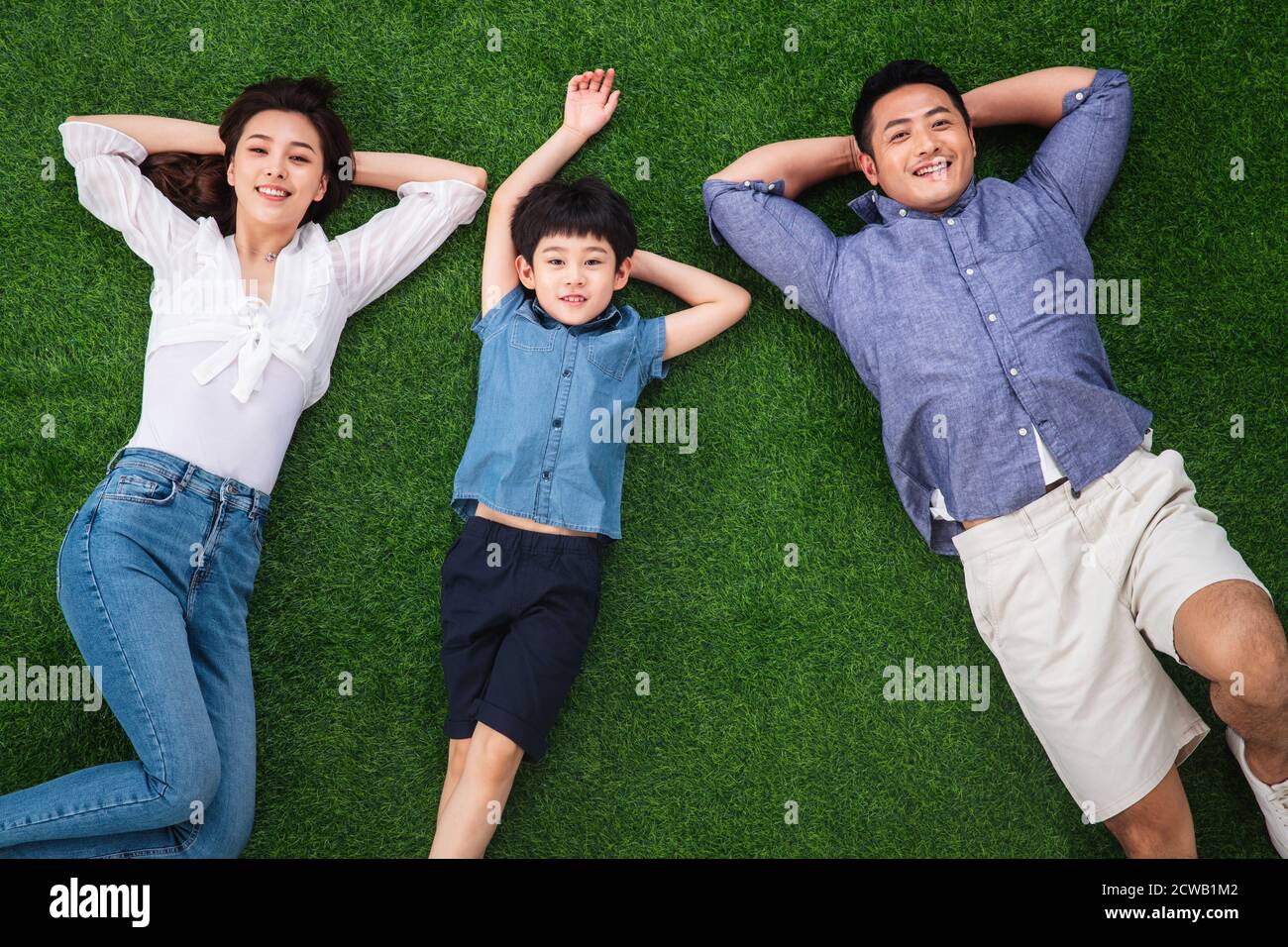 Father son lay on grass hi-res stock photography and images - Alamy