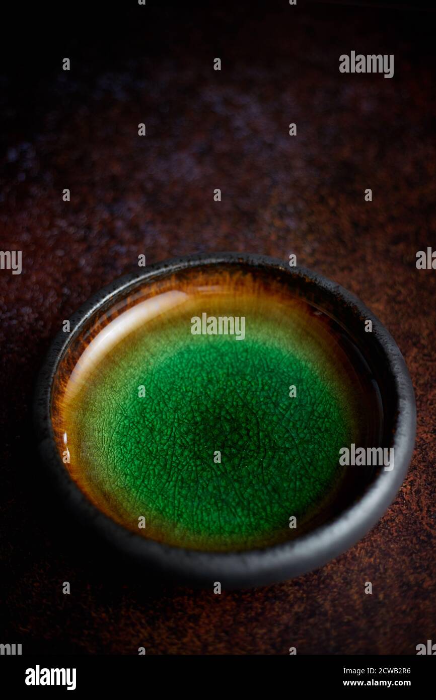 Handmade brown and green glaze rustic pottery bowl Stock Photo - Alamy