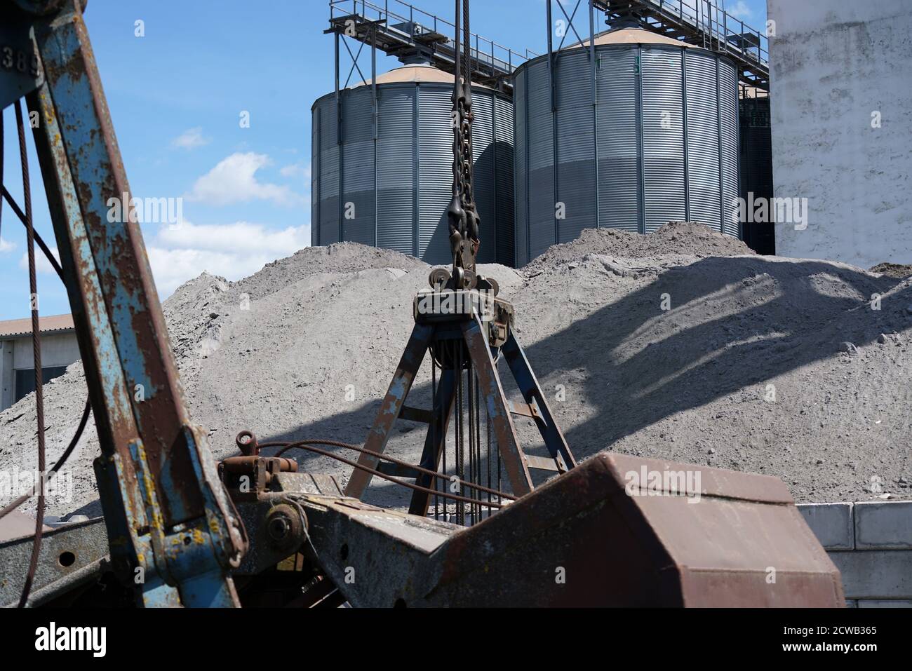 Sand loading station in the port with silos as a background Stock Photo ...