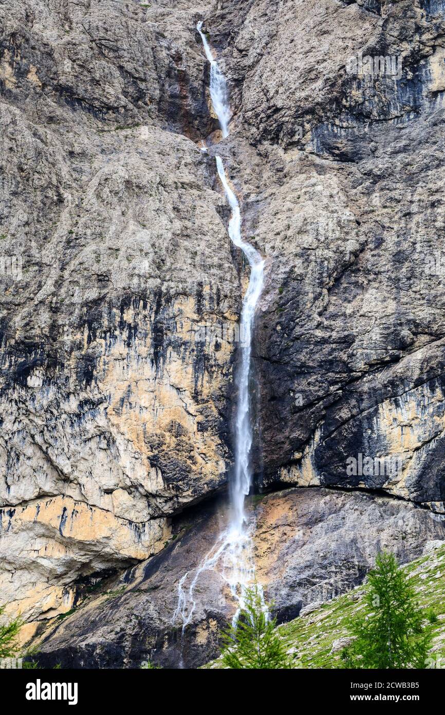 trickle of water flows across the rocks of the mountain to form a small ...