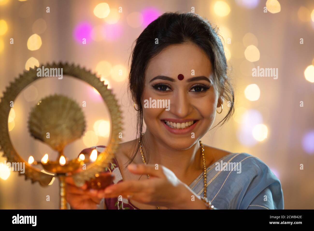 Lighting a diya hi-res stock photography and images - Alamy