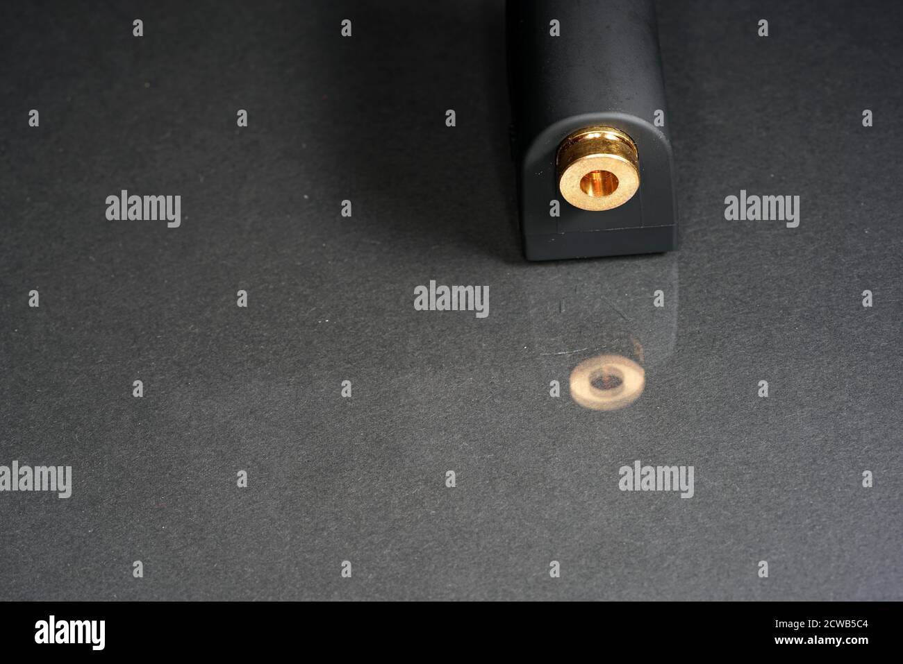 High angle shot of a photoelectric barrier on a reflective surface ...