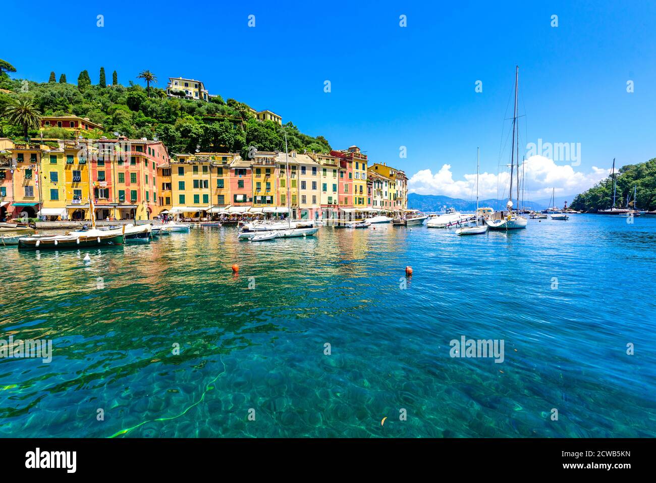Portofino, Italy - Harbor town with colorful houses and yacht in little ...