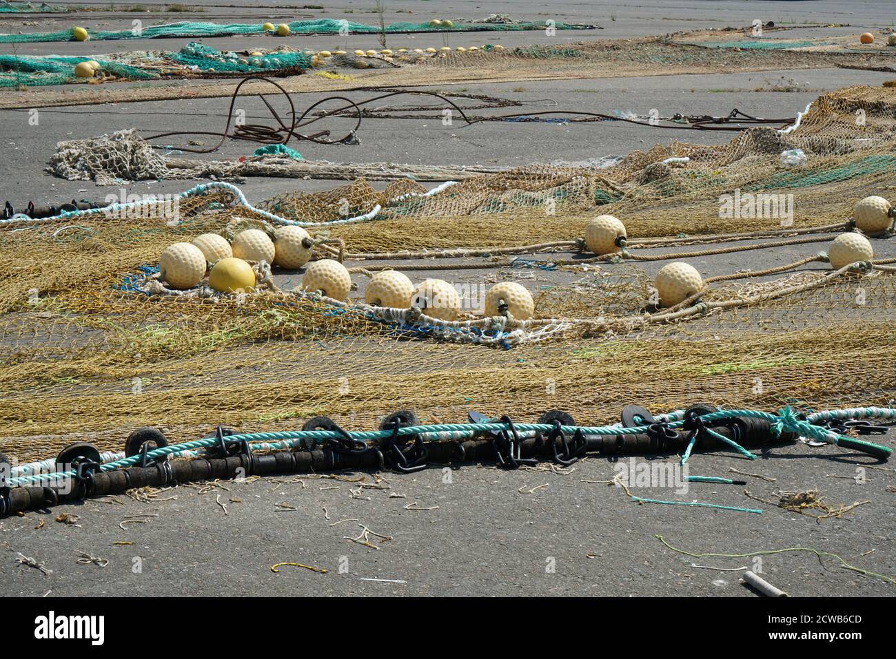 Large fishing net laid on the ground Stock Photo - Alamy