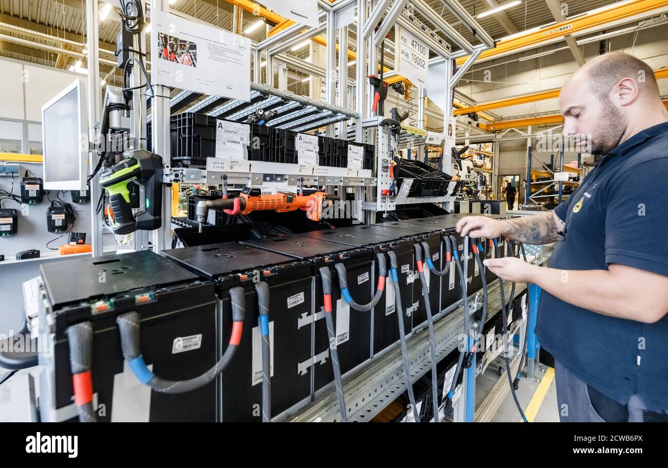 Norderstedt, Germany. 23rd Sep, 2020. One employee manufactures lithium ...