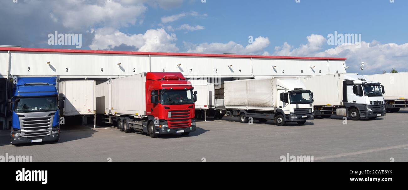 Trucks loading at a depot of a forwarding agency - Transport and ...