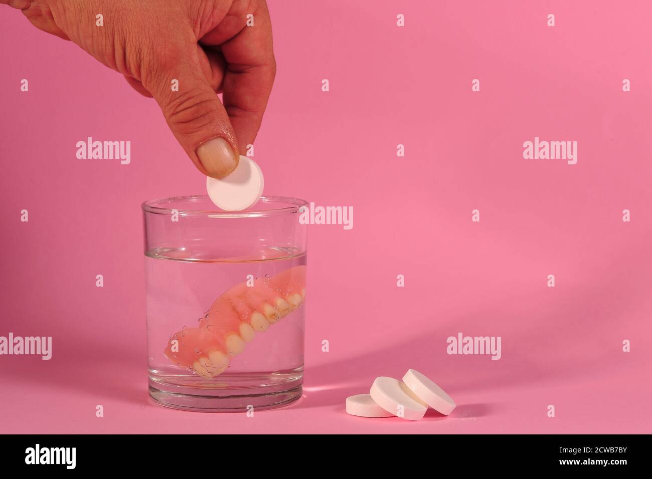 cleaning false teeth Stock Photo - Alamy