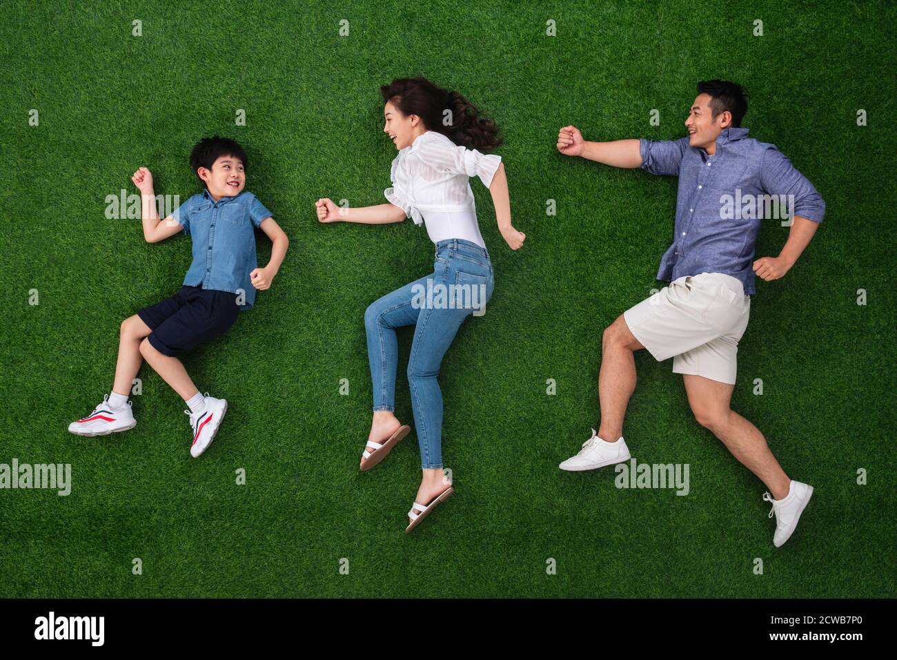 Happy three running Stock Photo - Alamy