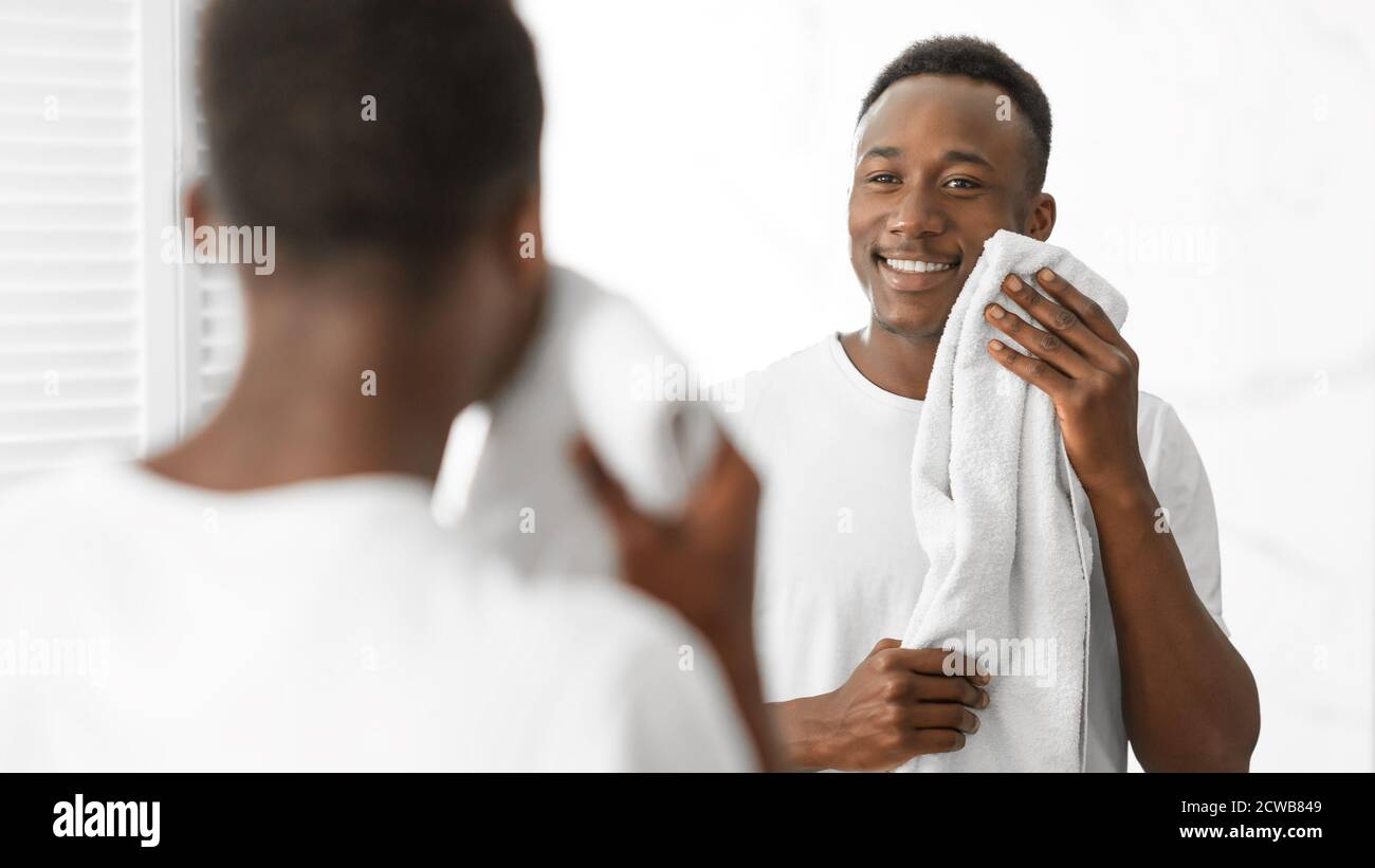 Man wiping face shirt hi-res stock photography and images - Alamy