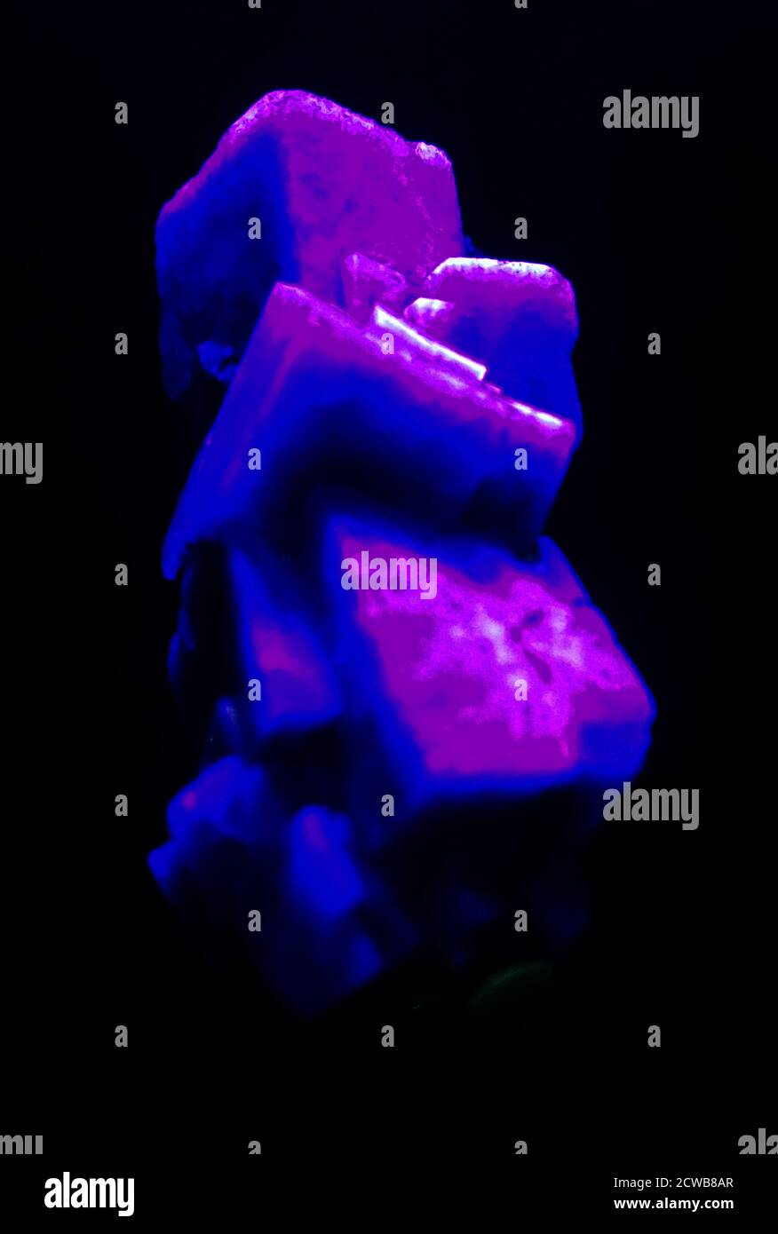Sample of Fluorite glowing under U.V. light Stock Photo - Alamy