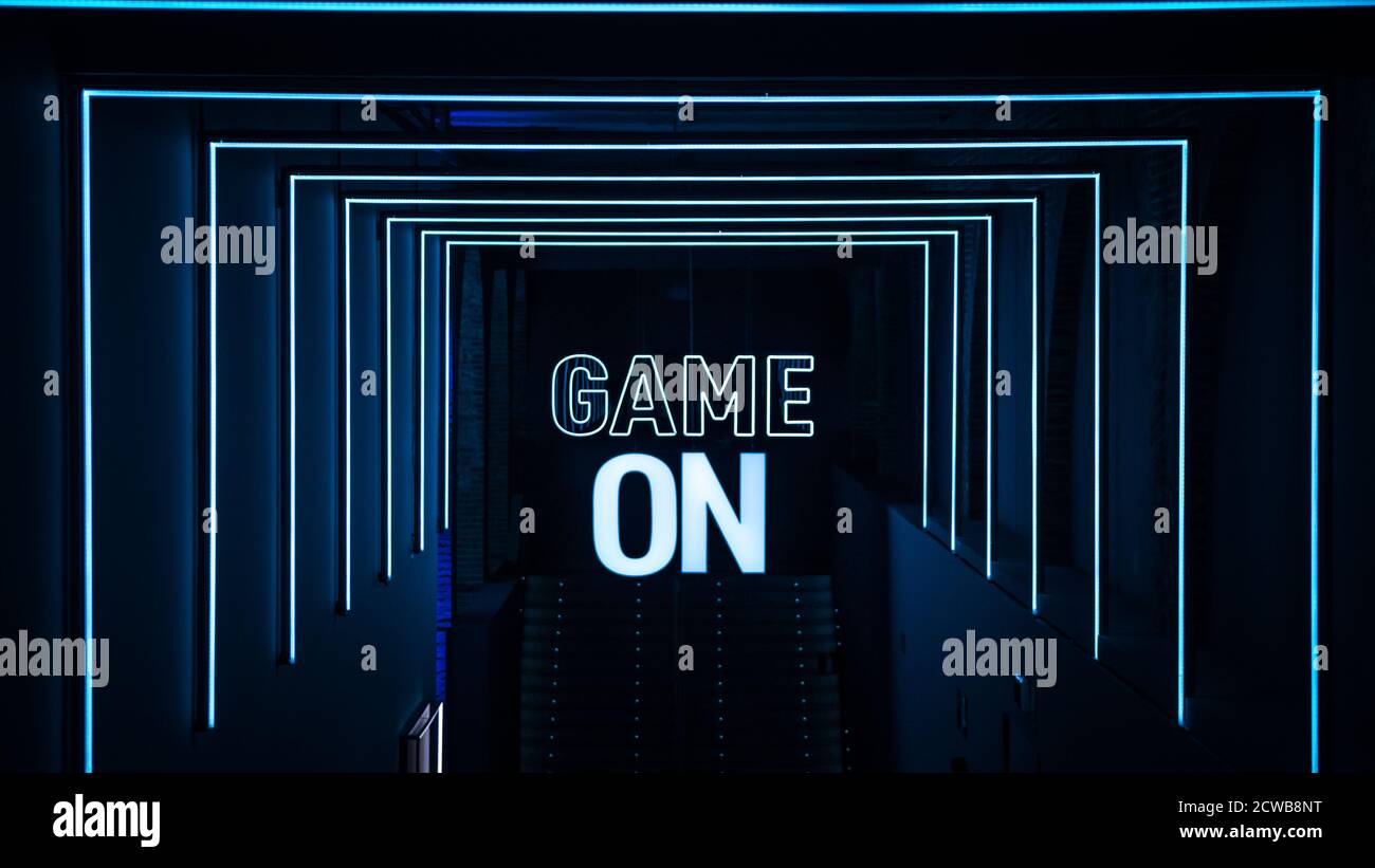 Blue neon "GAME ON" sign leading to the hallway at a gaming expo Stock ...