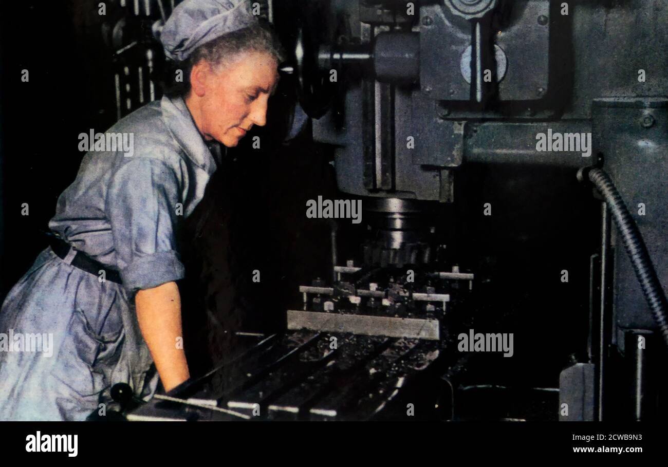 Female engineering worker in a metalwork's. England, during World War ...