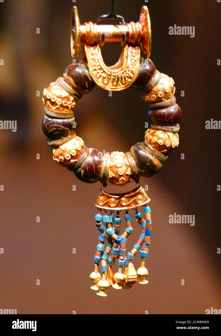 Gold Inlaid pendant earing showing Tutankhamen flanked by Uraei. from ...