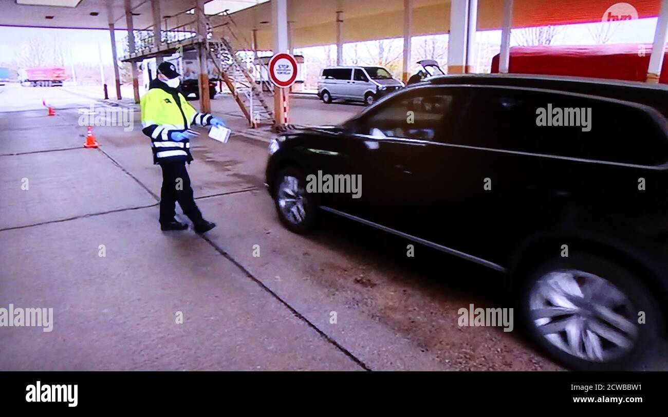 border check on passengers in a car during the COVID-19 pandemic March ...