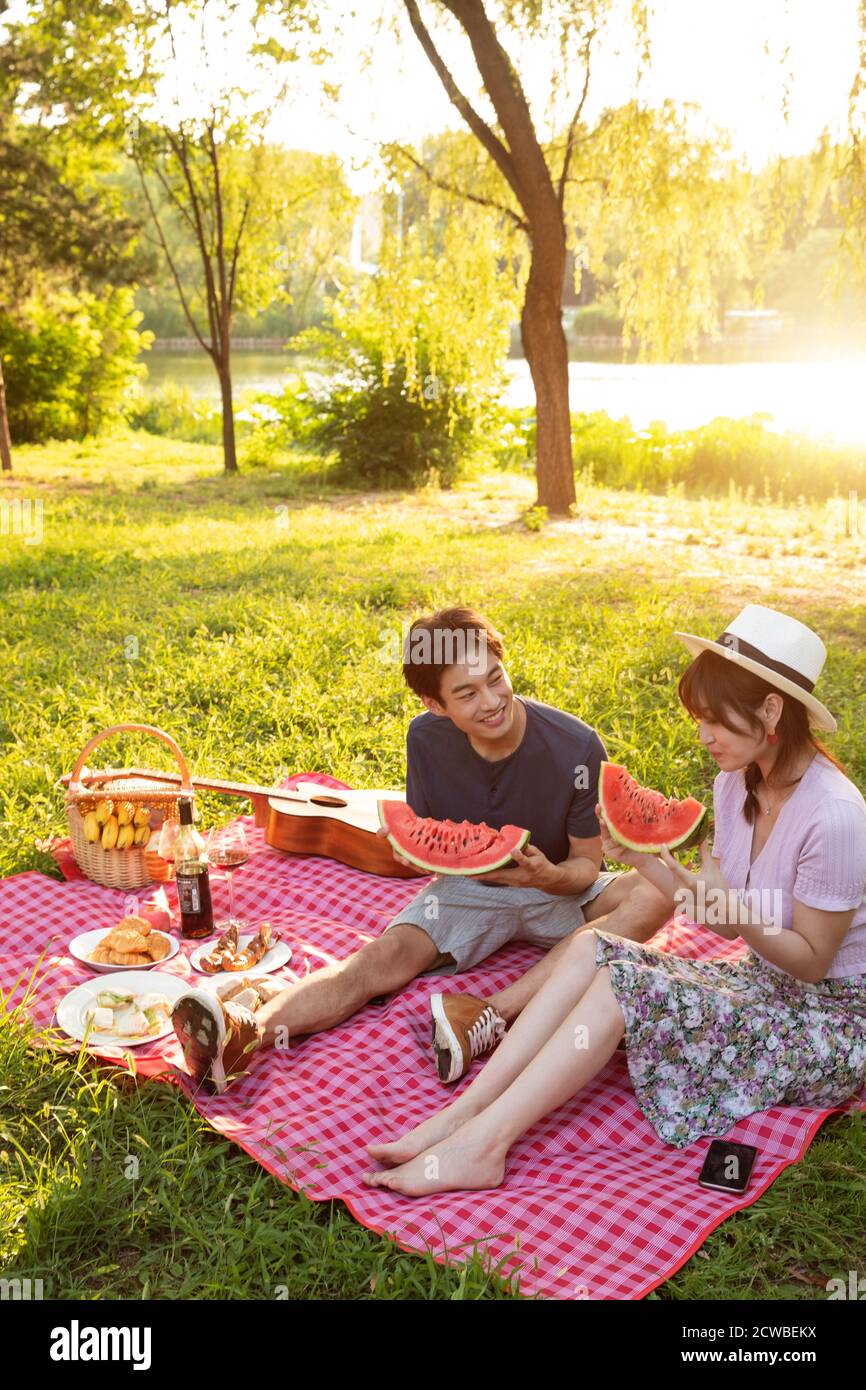 Happy couples in the park for an outing Stock Photo - Alamy
