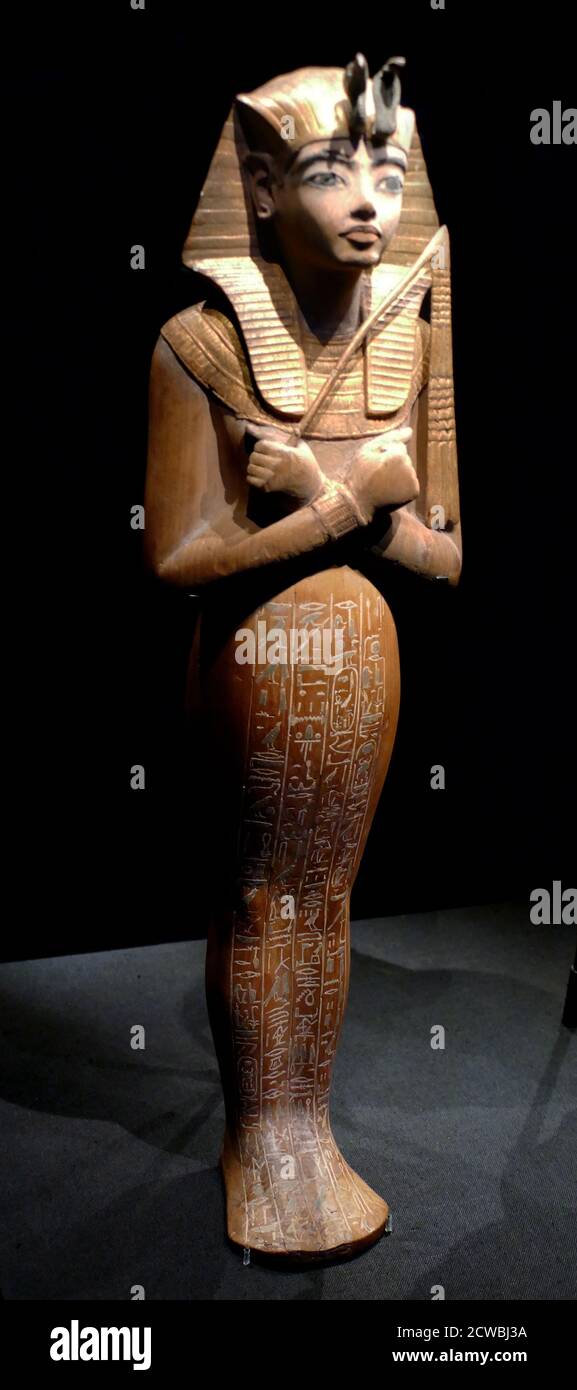 painted wooden Shabti figure, with gilded nemes headdress and collar ...