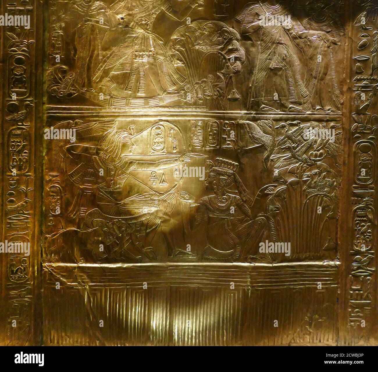 Gilded wooden shrine with depictions of Tutankhamun and Ankhesenamun ...
