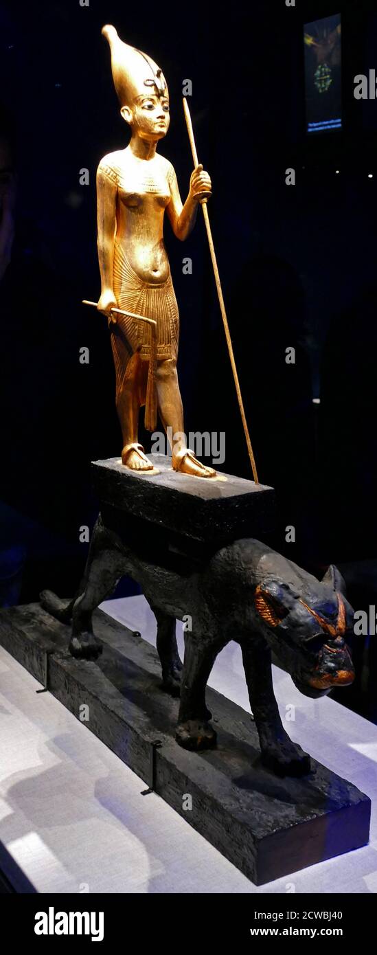 Gilded wooden statue of King Tutankhamun. 1326 BC From the tomb of King ...