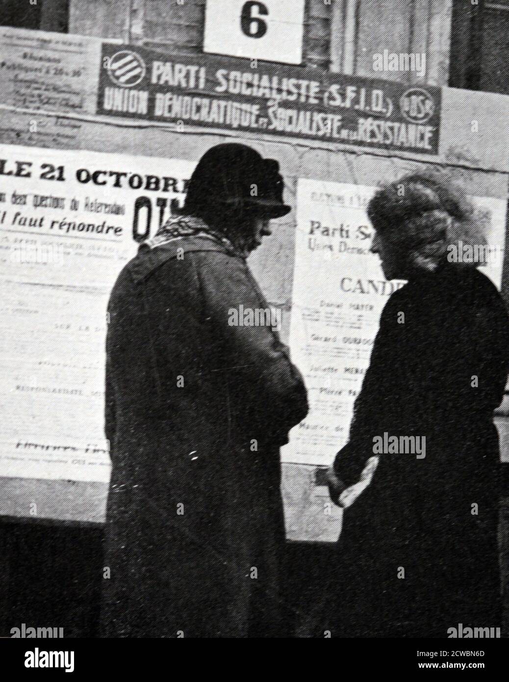 Black and White photograph of two women reading posters about the ...