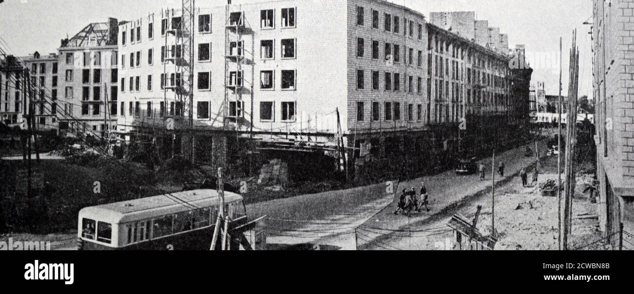 Black and white photograph showing the reconstruction of a destroyed ...