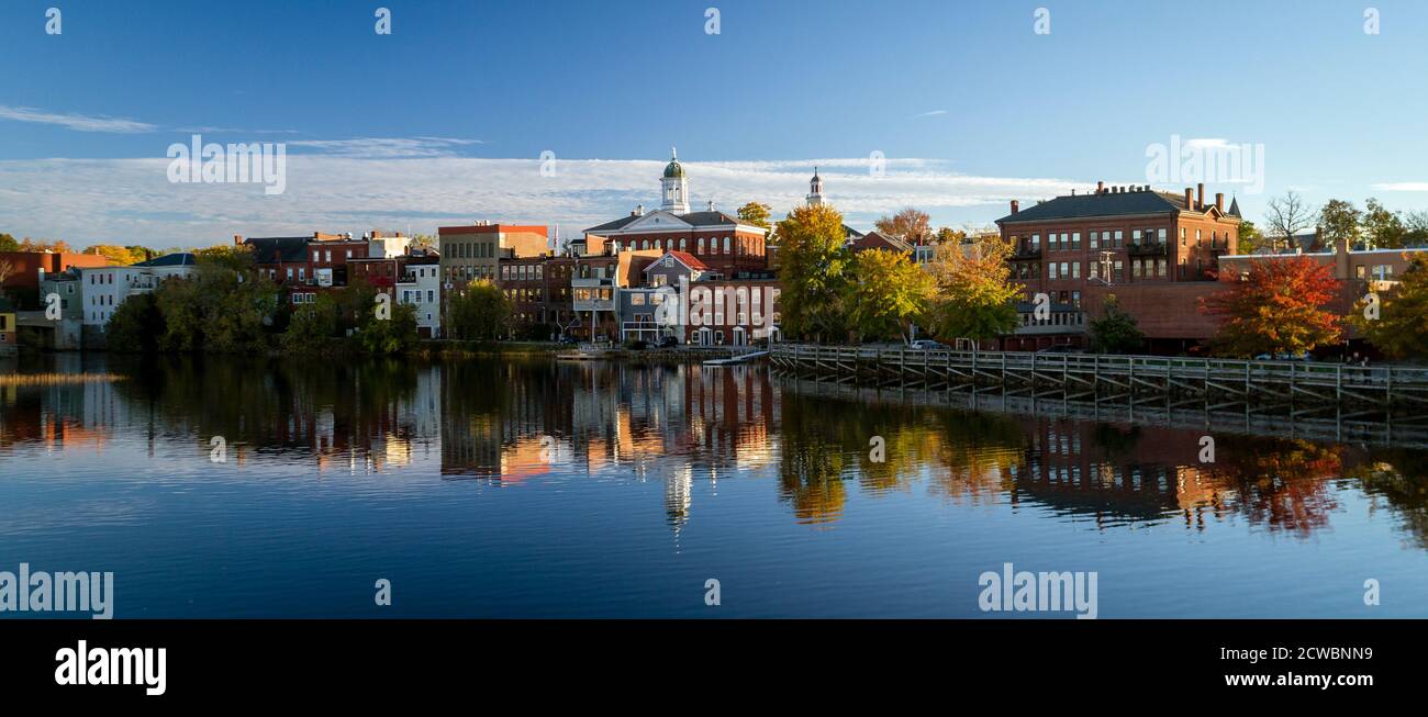 The river front buildings of Exeter, New Hampshire are seen reflected ...