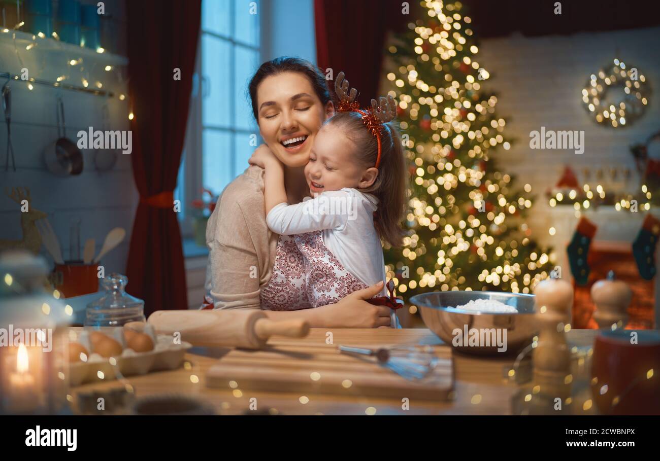 Merry Christmas and Happy Holidays. Family preparation holiday food ...