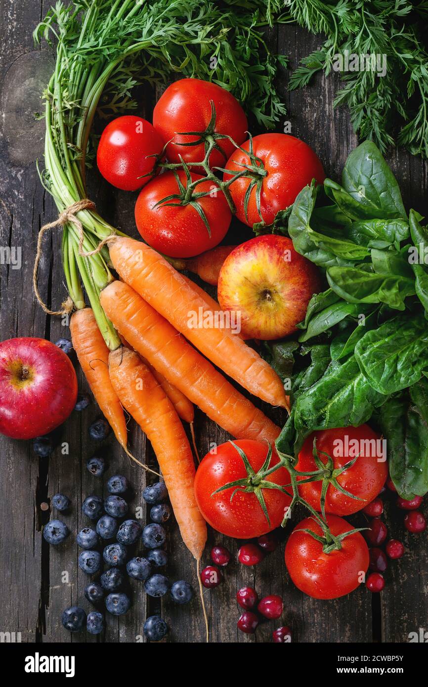 Assortment of fresh fruits, vegetables and berries carrot, spinach ...