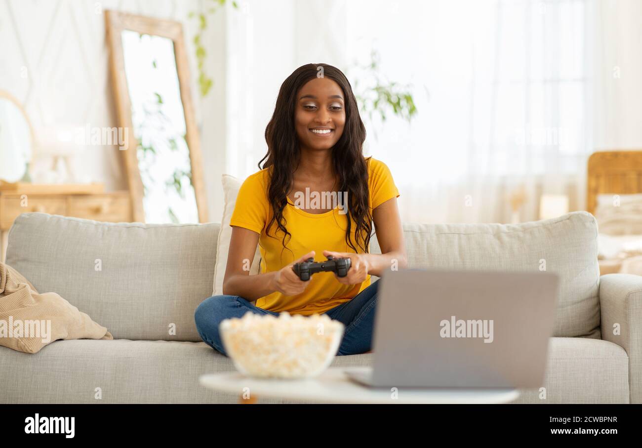 Gamer playing on playstation controller hi-res stock photography and ...