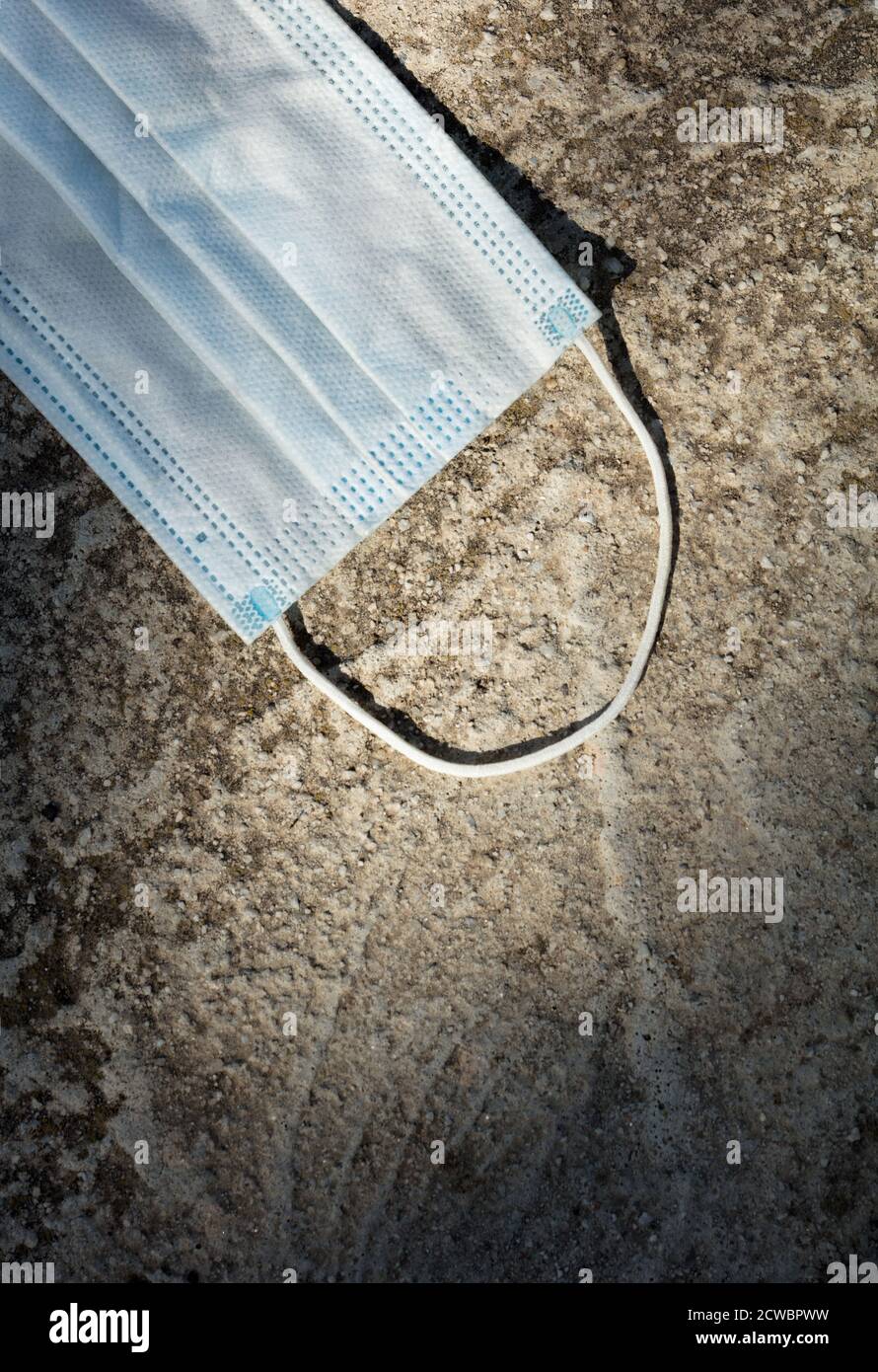 Medical protection mask lost on the ground was used. Disposable mask ...